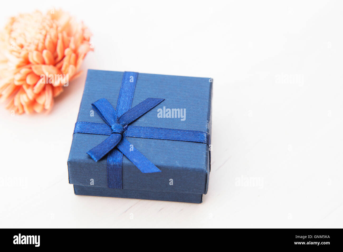 Blue ribbon gift box Stock Photo - Alamy