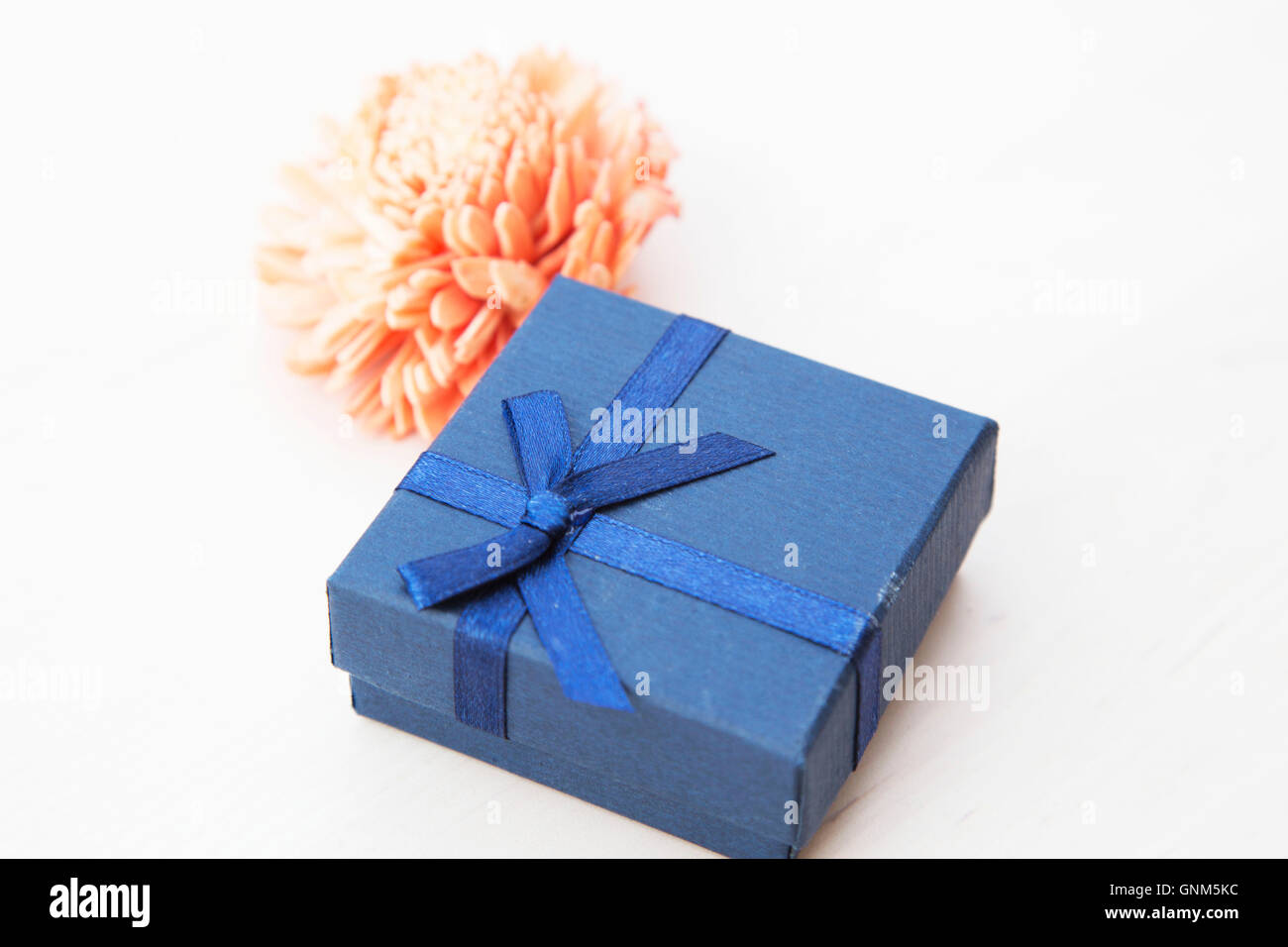 Blue ribbon gift box Stock Photo - Alamy