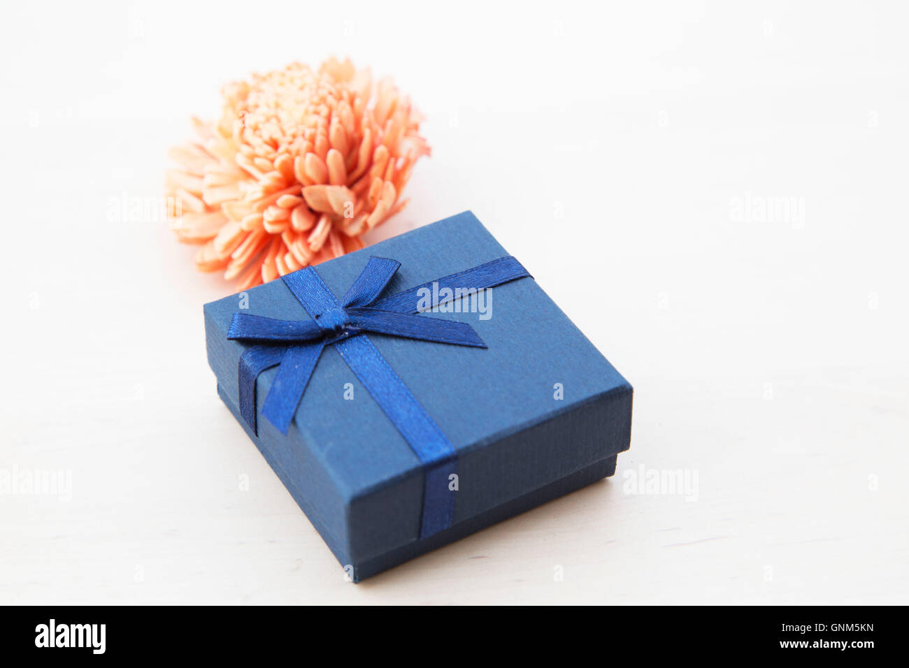 Blue ribbon gift box Stock Photo - Alamy