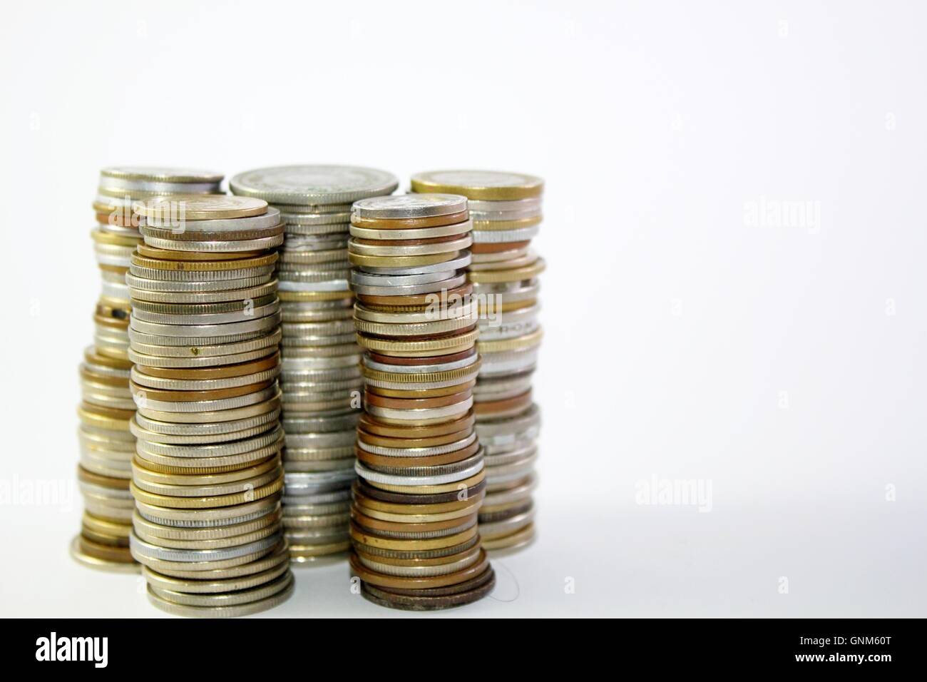 Piles of coins Stock Photo - Alamy