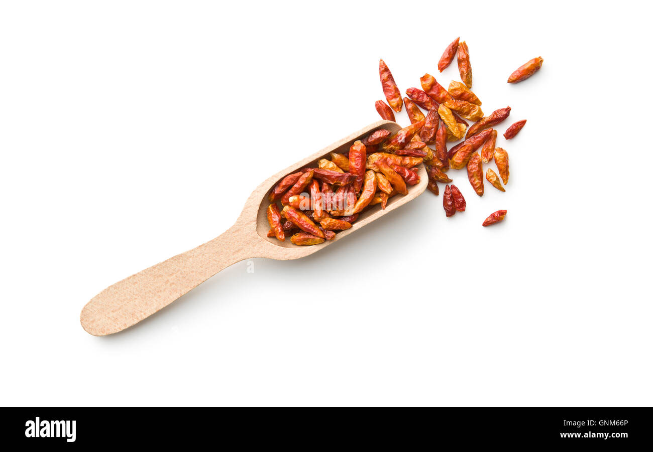 Dried mini chili peppers in wooden scoop. Isolated on white background ...