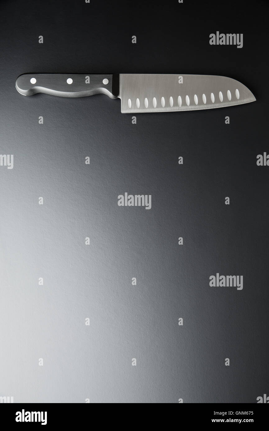 The kitchen knife on black background Stock Photo - Alamy