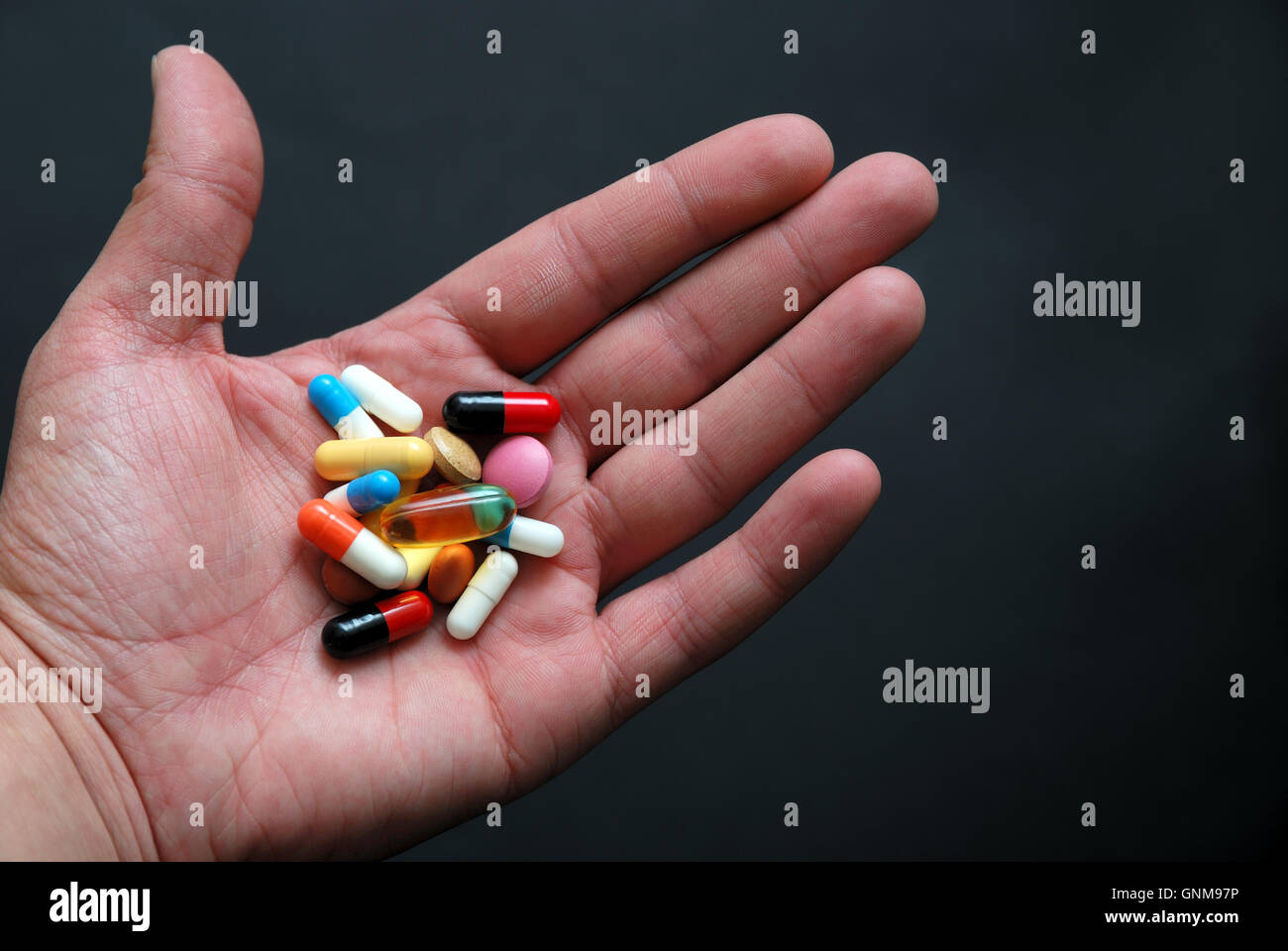 pills in hand Stock Photo - Alamy