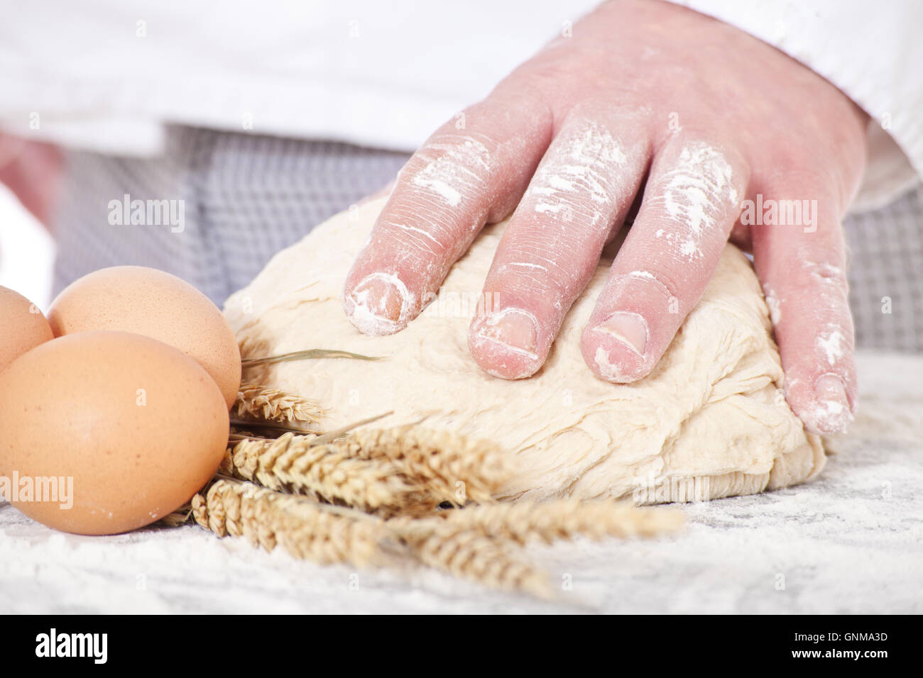 Baker checking dough Stock Photo - Alamy