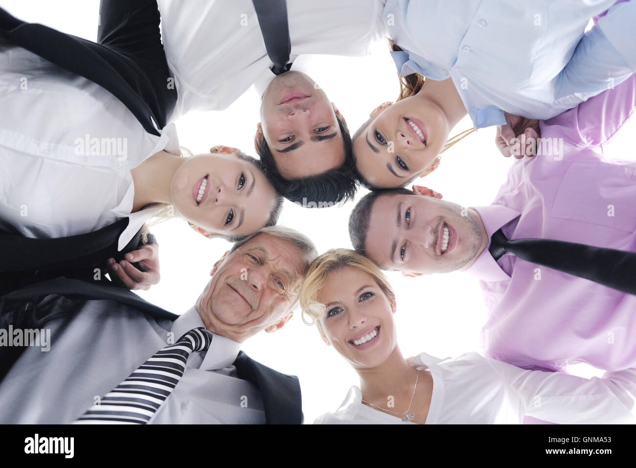 business people with their heads together Stock Photo - Alamy