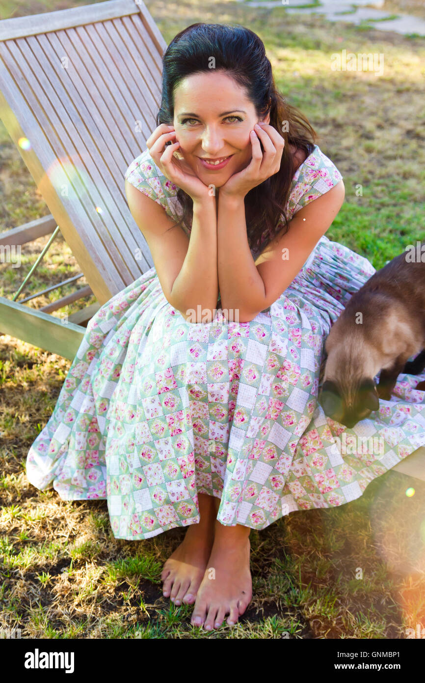 romantic young woman in spring with siamese cat Stock Photo - Alamy