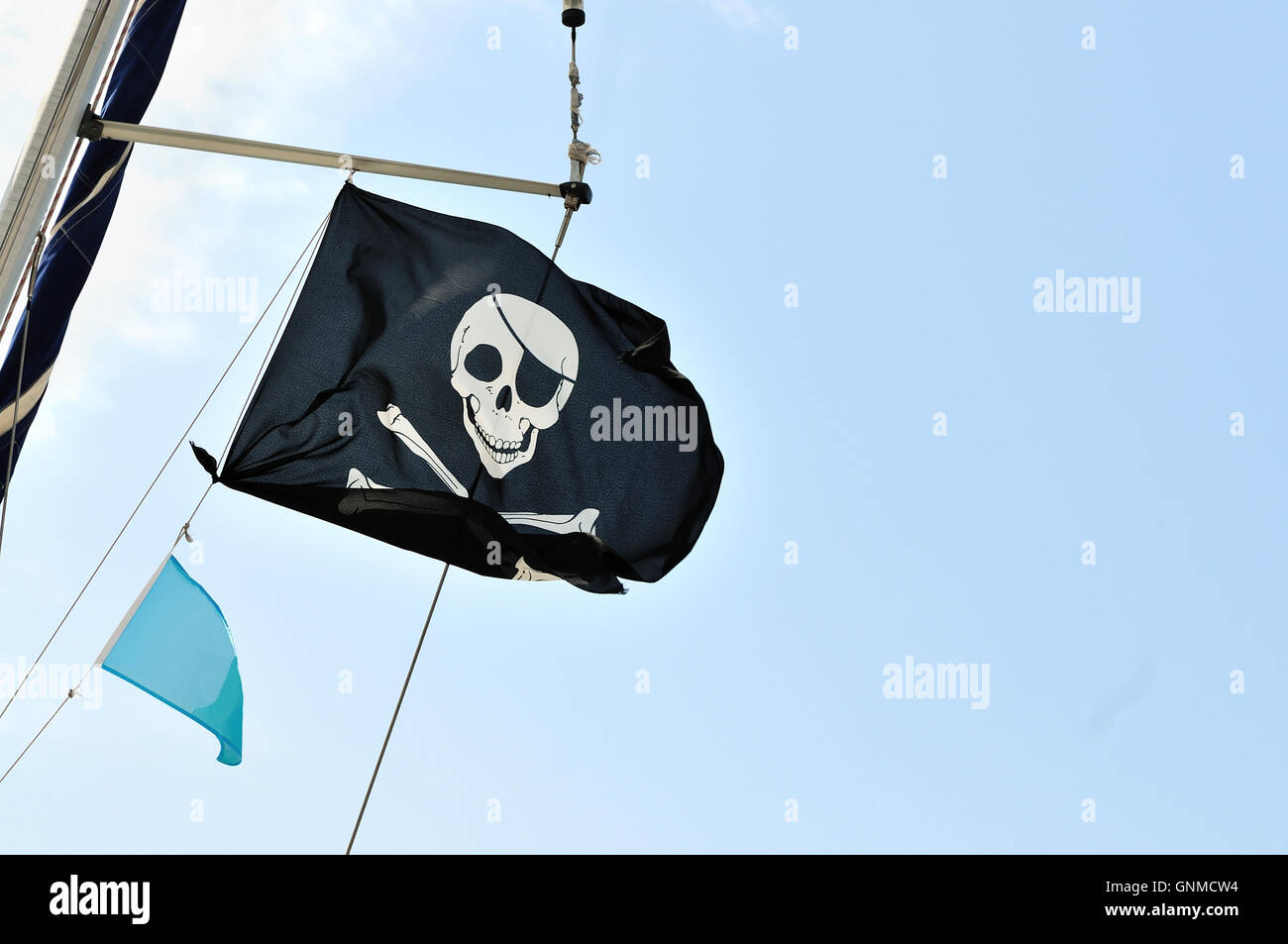 Piracy flag fluttering wind hi-res stock photography and images - Alamy