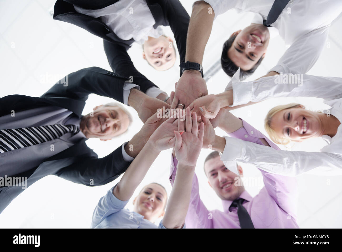business people group joining hands Stock Photo - Alamy
