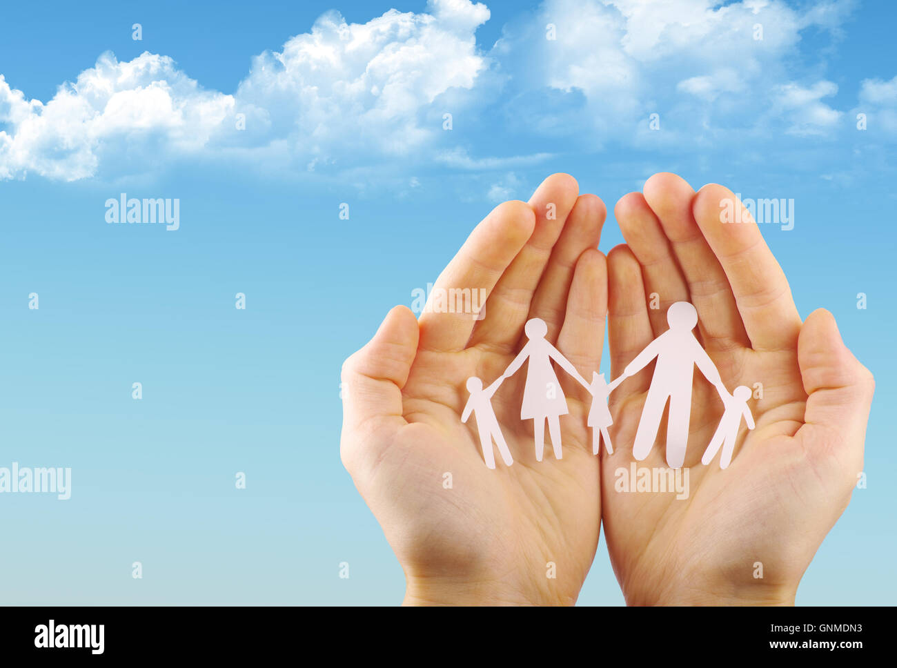 Paper family in hands Stock Photo - Alamy