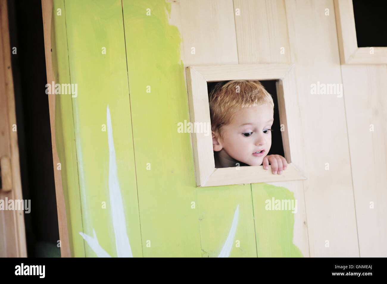 happy child in a window Stock Photo - Alamy