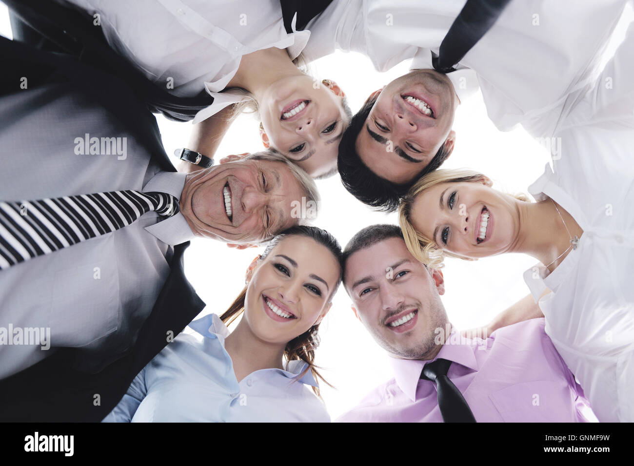 business people with their heads together Stock Photo - Alamy