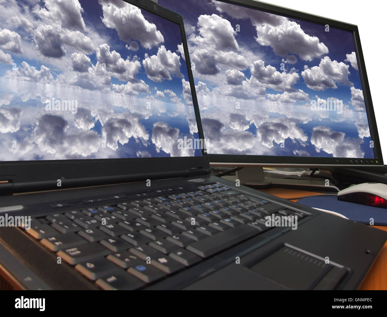 dramatic blue sky on dual display Stock Photo - Alamy