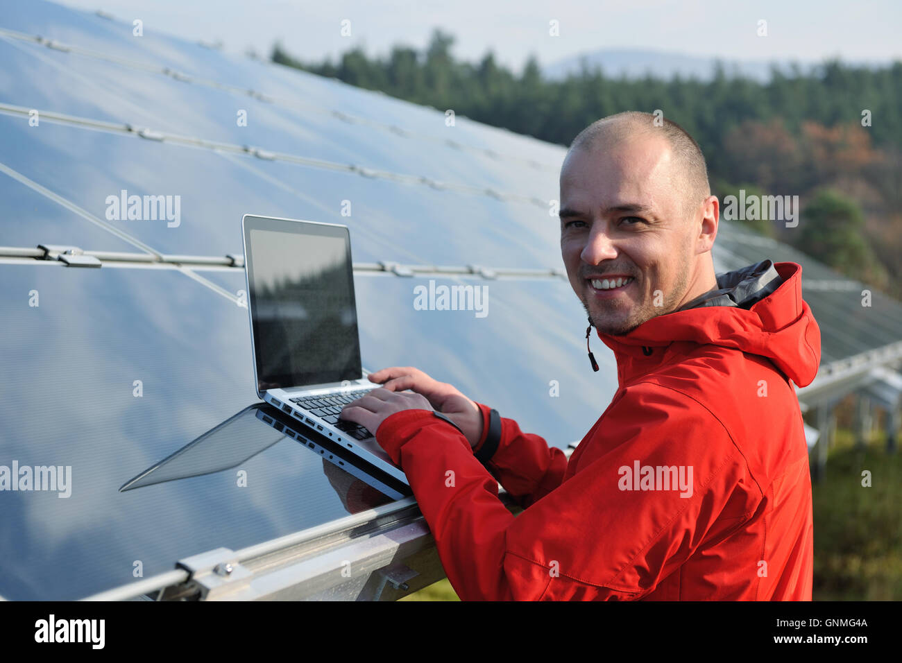 engineer using laptop at solar panels plant field Stock Photo - Alamy
