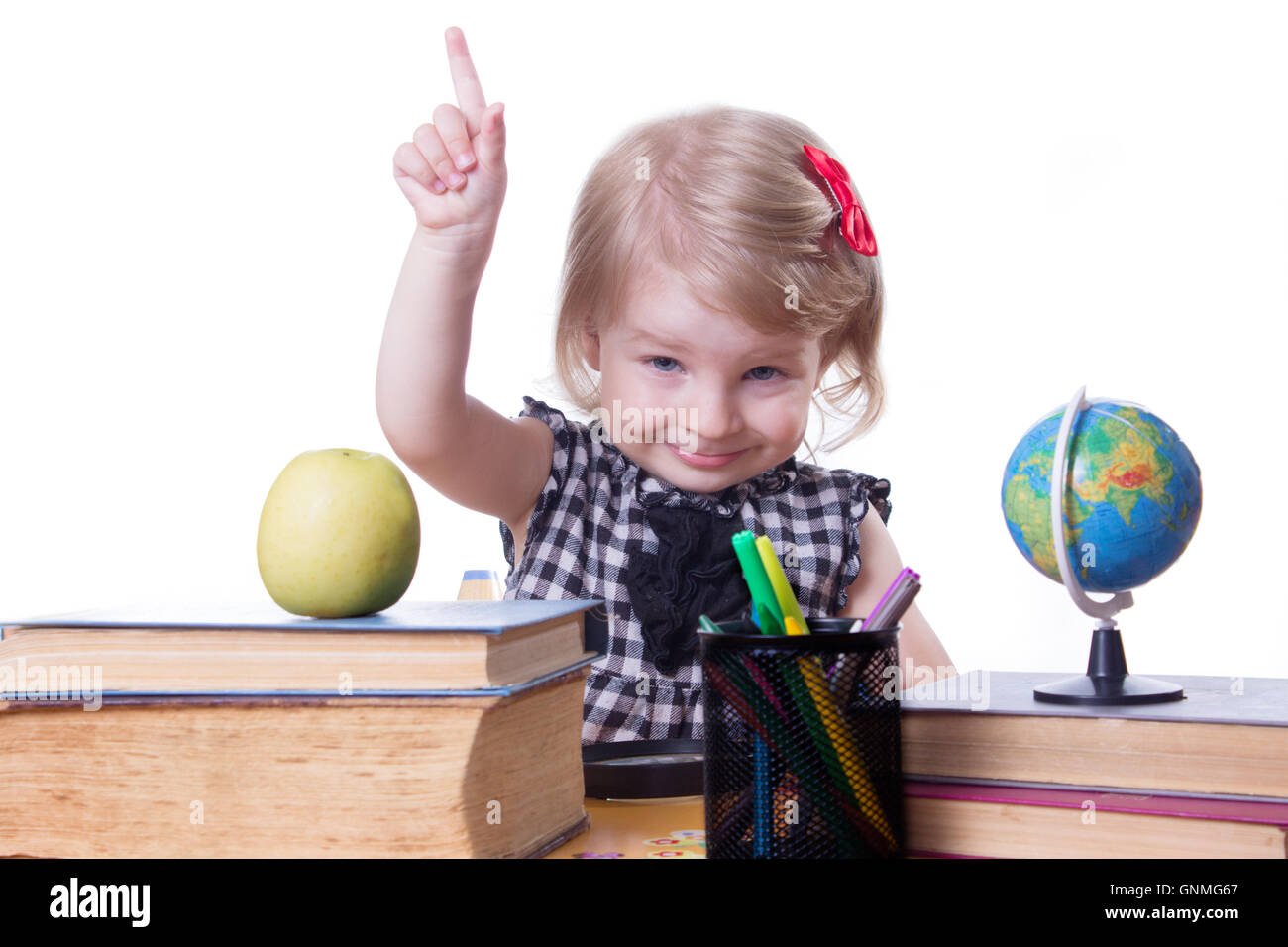 Girl in classroom raising finger up Stock Photo - Alamy