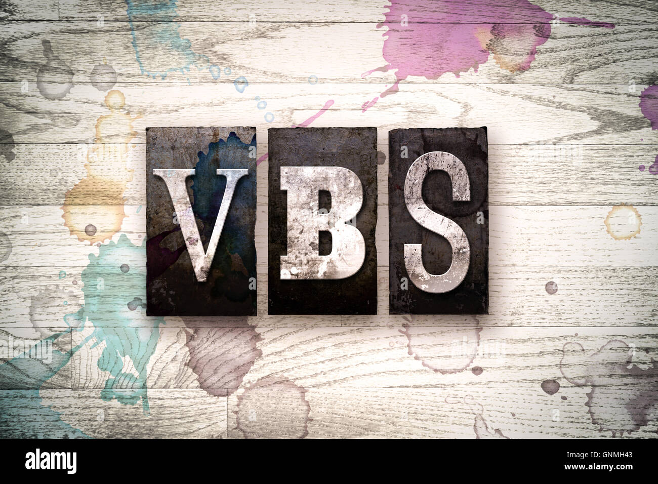 The word "VBS" written in vintage, dirty metal letterpress type on a ...