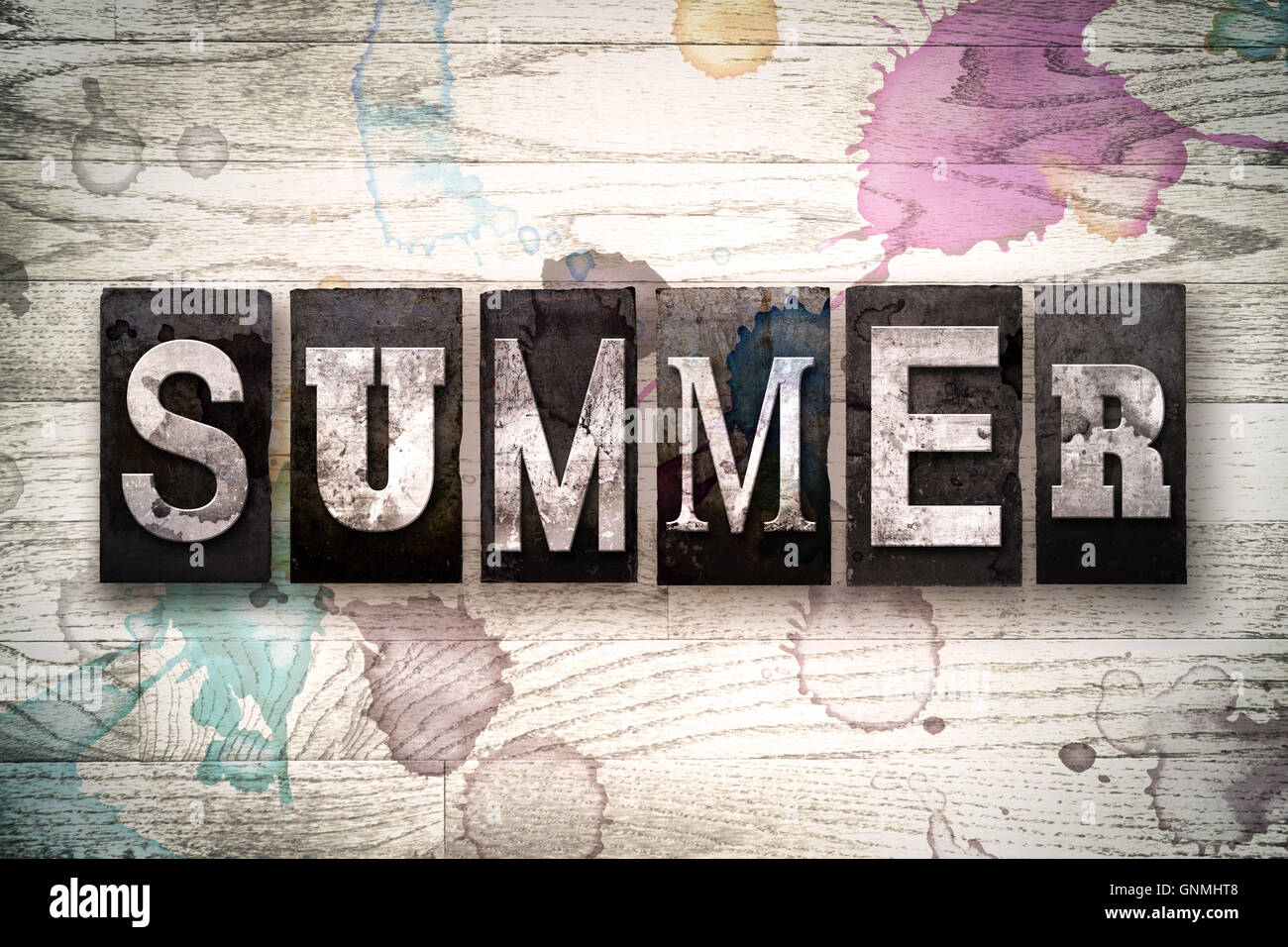 The word "SUMMER" written in vintage, dirty metal letterpress type on a ...