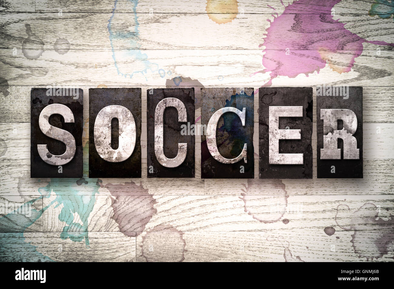 The word "SOCCER" written in vintage, dirty metal letterpress type on a ...
