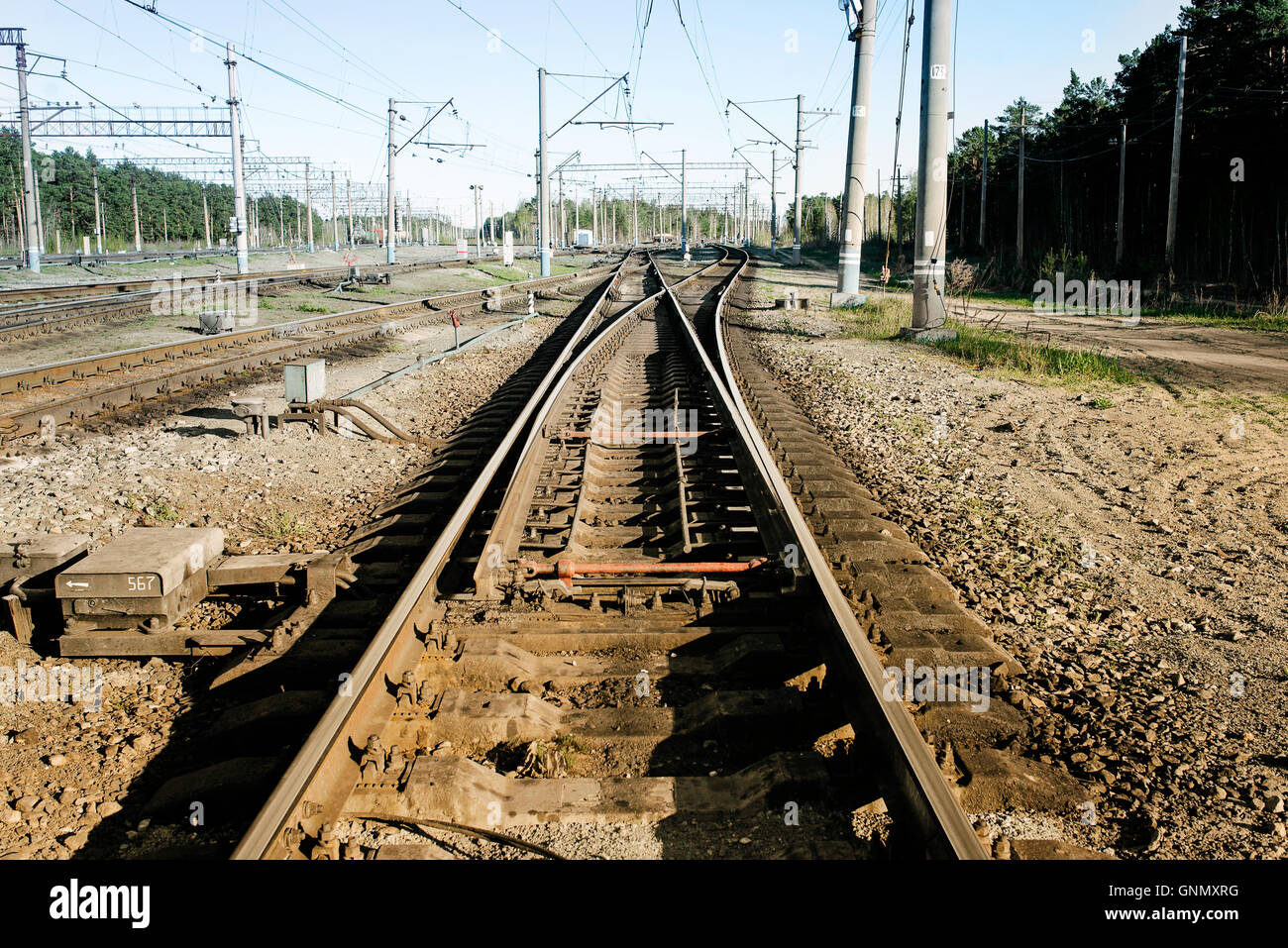 Railway tracks, rails and electric columns Stock Photo - Alamy