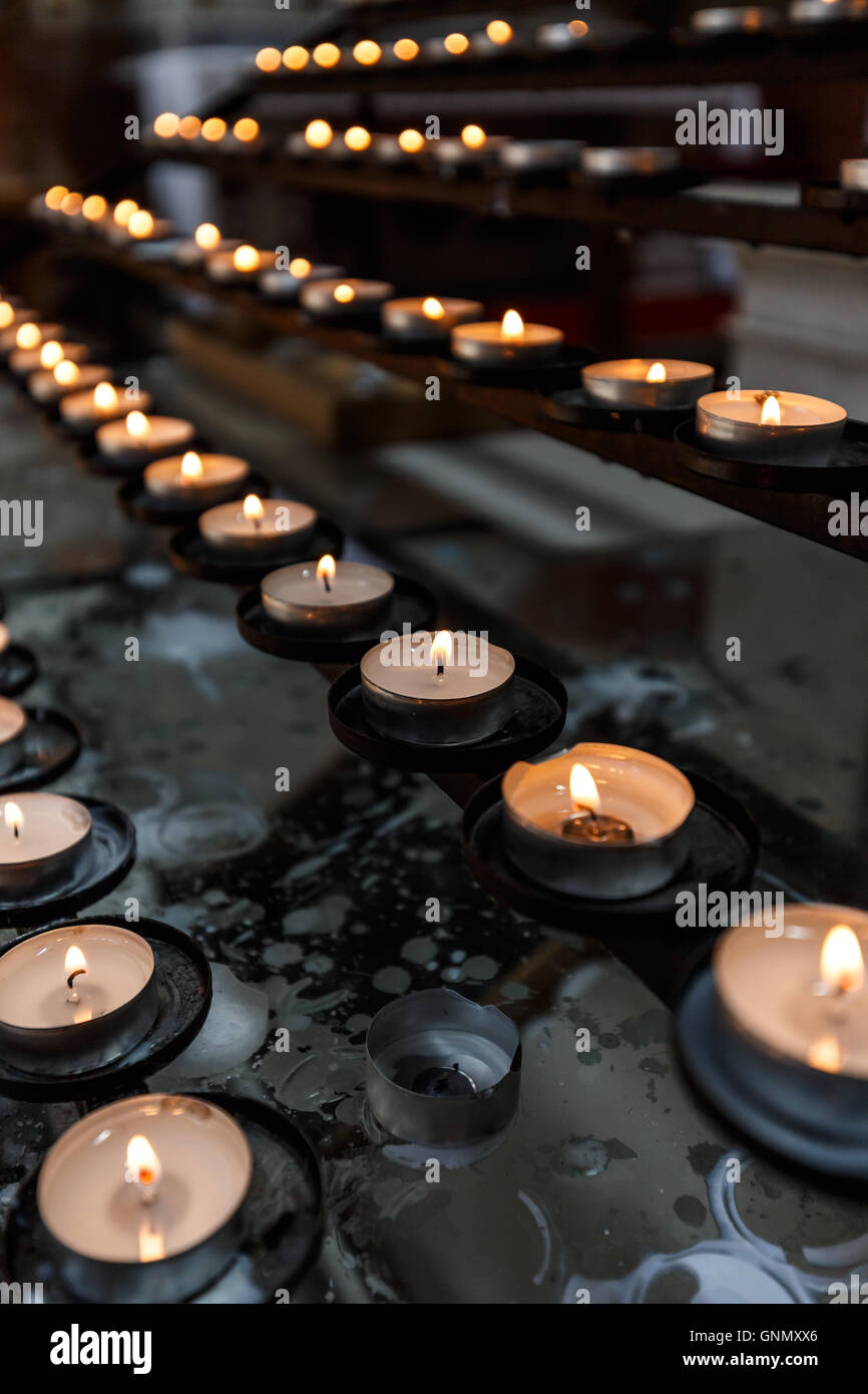 Many candles burning at temple interior Stock Photo - Alamy