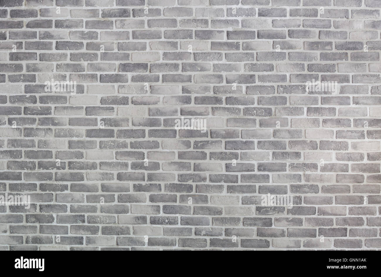 Old grey brick wall for background or texture Stock Photo - Alamy