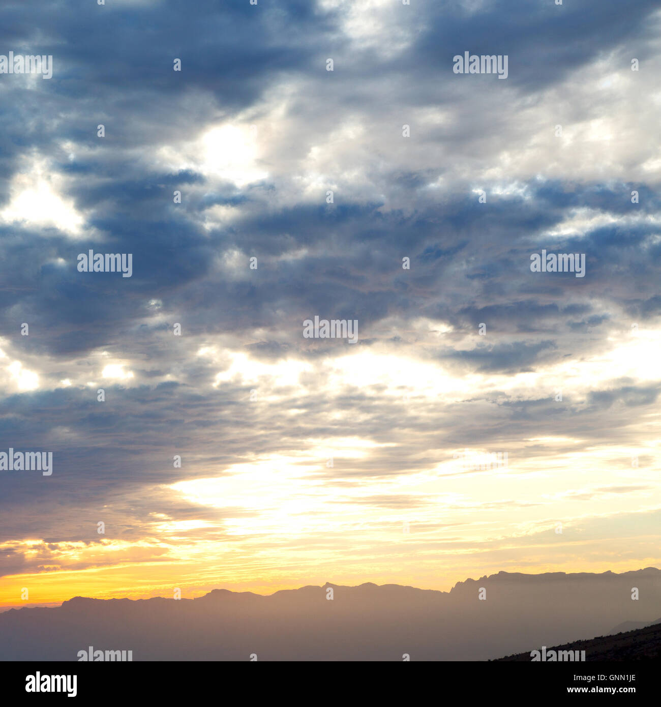 the blurred sun falling down arabian mountain in oman Stock Photo - Alamy