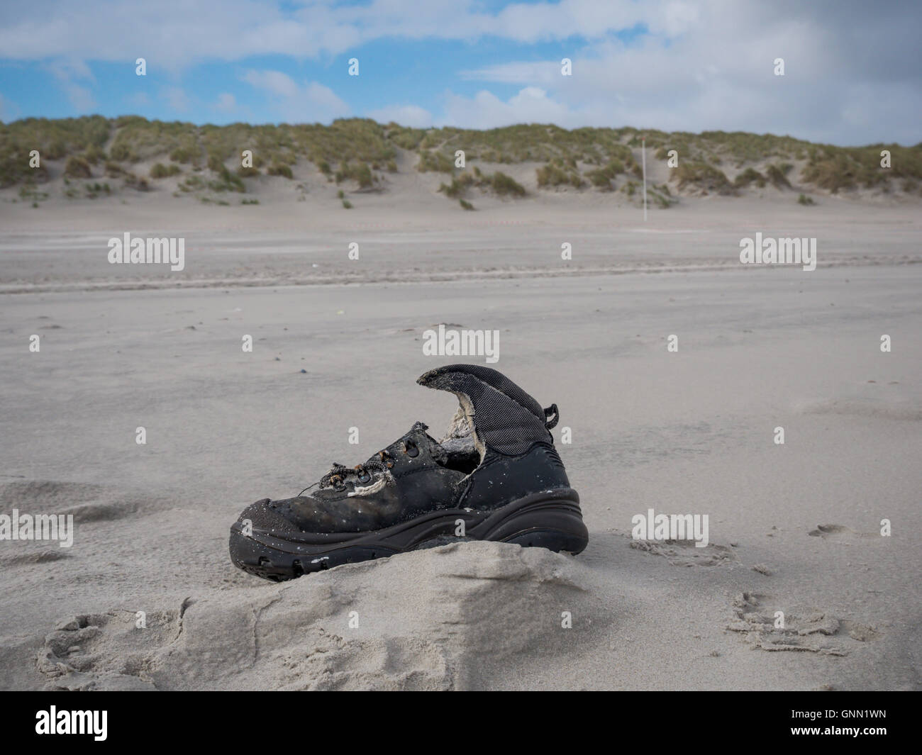 Stranded shoe on beach Stock Photo - Alamy