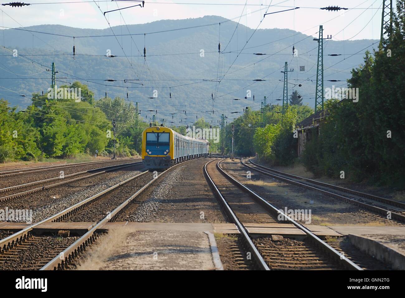 Railroad tracks with train Stock Photo - Alamy