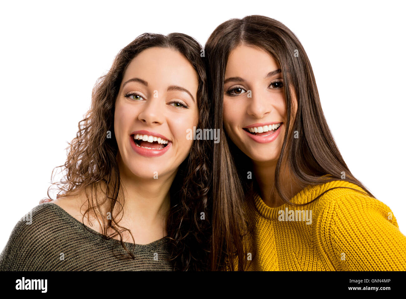 Studio portrait of two beautiful girls smiling Stock Photo - Alamy