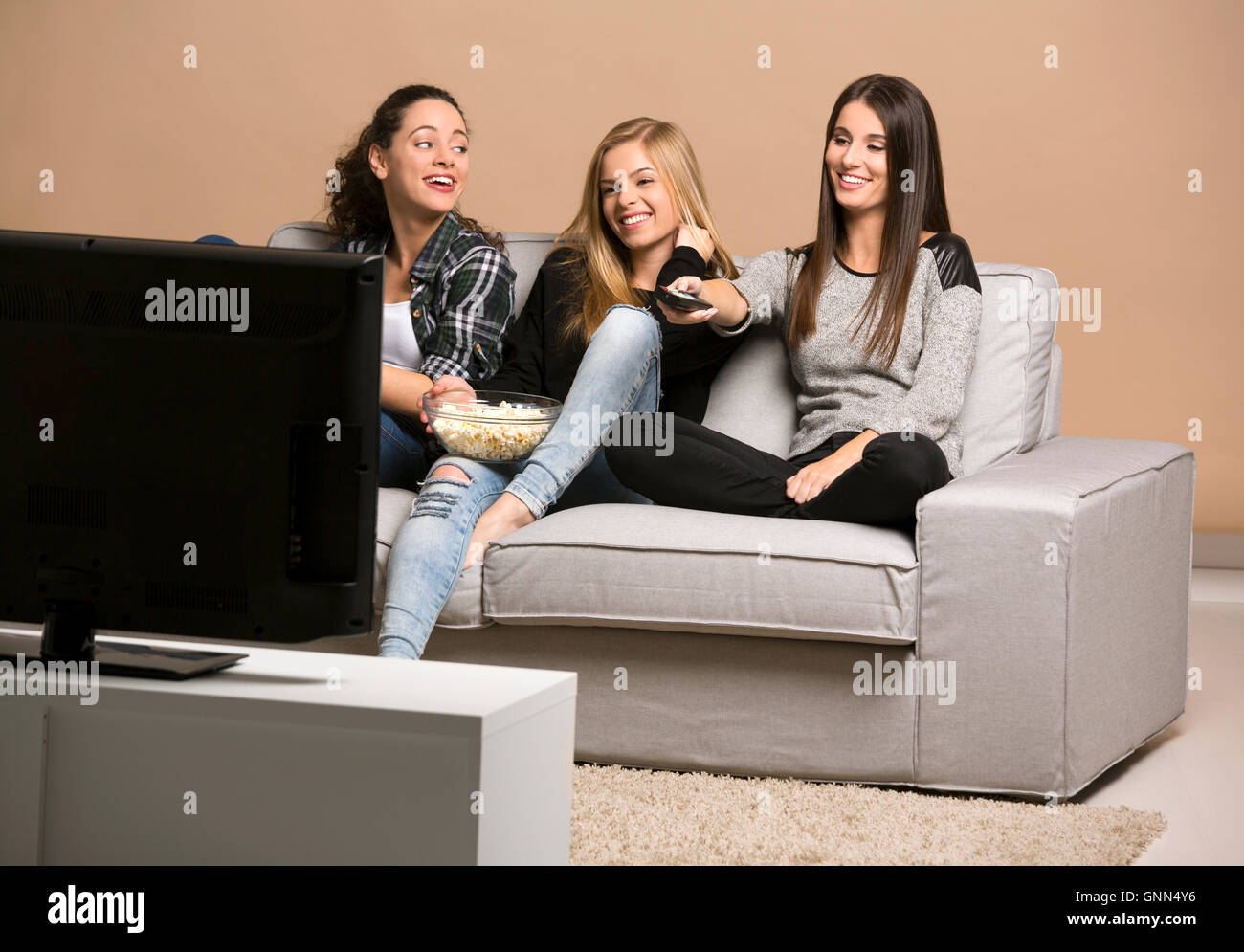 Girls watching movies with popcorn Stock Photo - Alamy