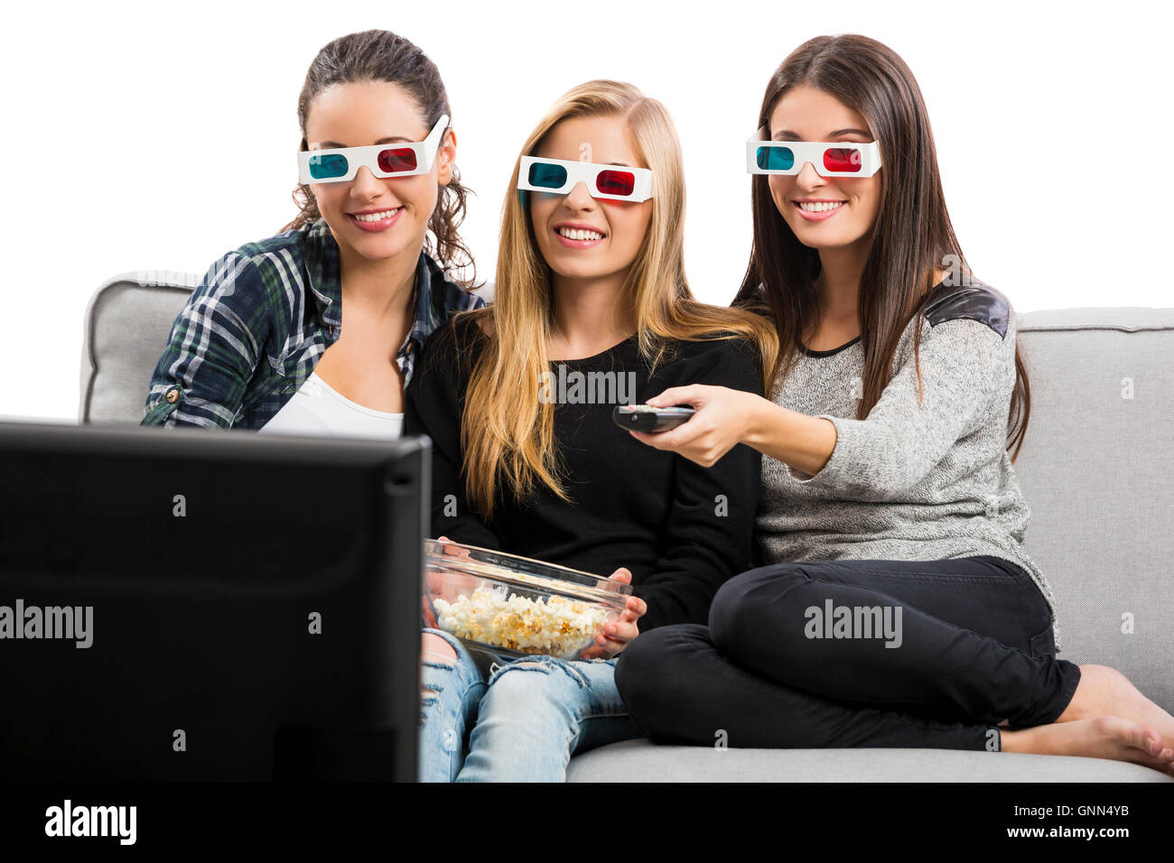 Girls watching 3D movies with popcorn Stock Photo - Alamy