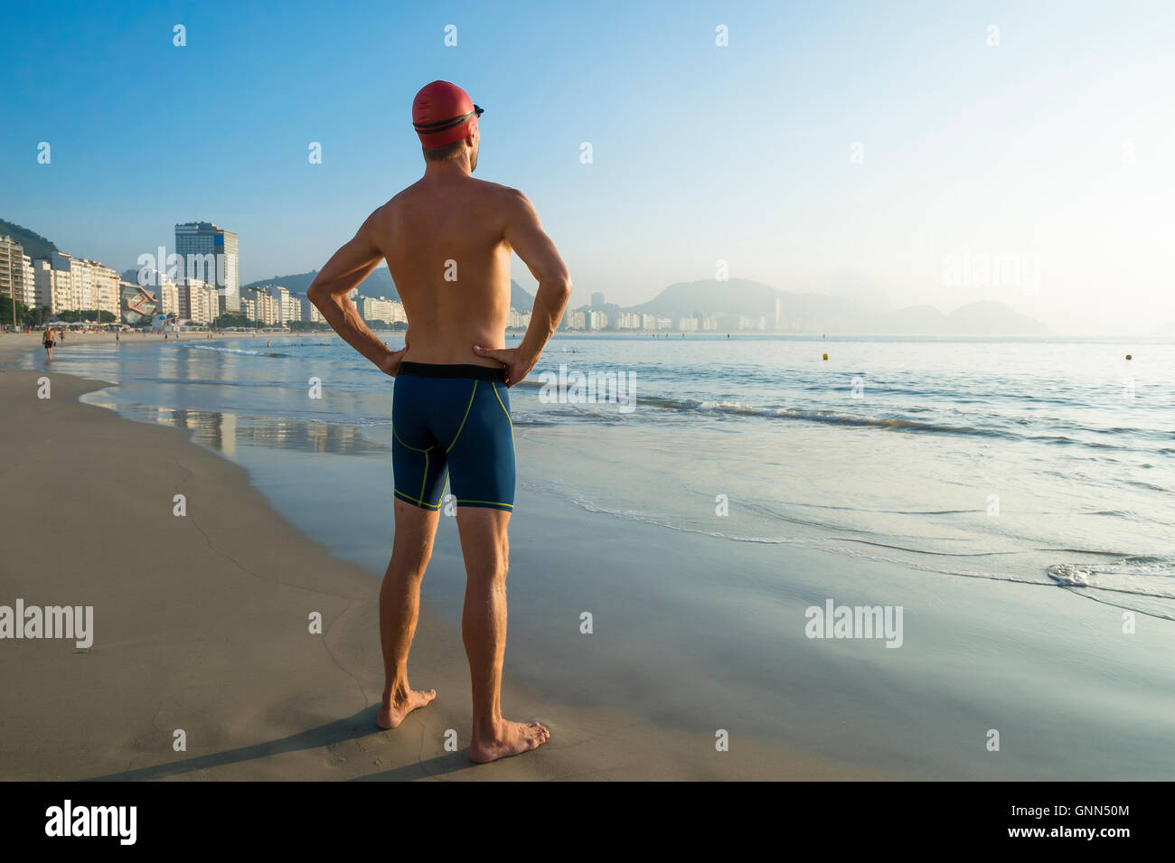 Athlete swimmer standing on Copacabana Beach in Rio de Janeiro, Brazil ...