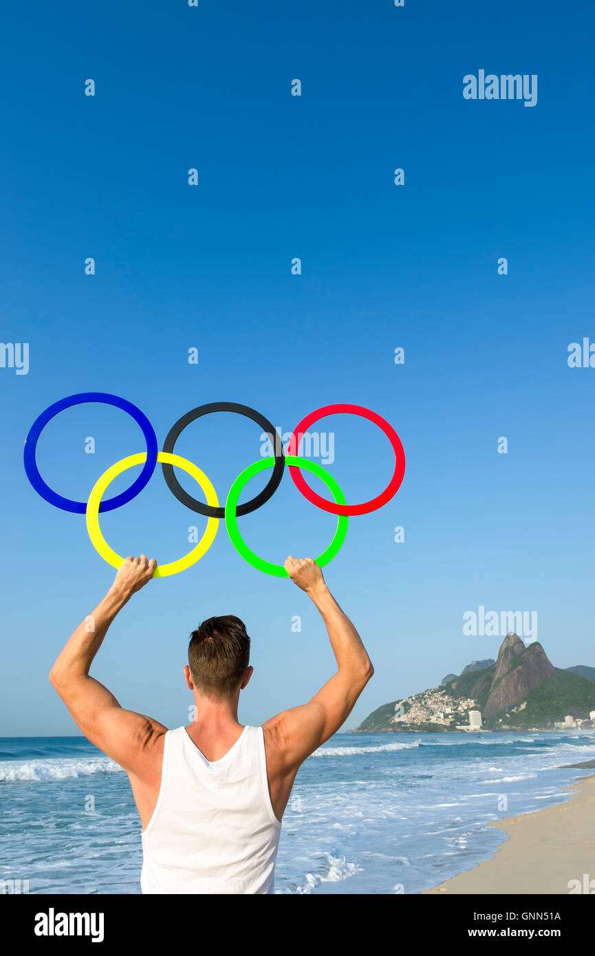 RIO DE JANEIRO - MARCH 15, 2016: Athlete holds Olympic rings on the ...