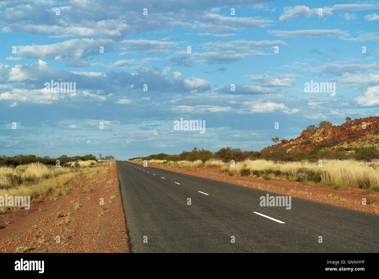 Endless red Outback road near the Karijini National Park, Pilbara ...