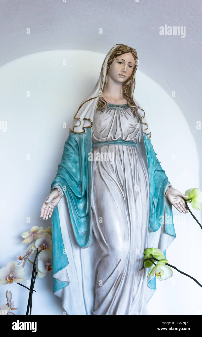 Statue of holy woman isolated on light background Stock Photo - Alamy