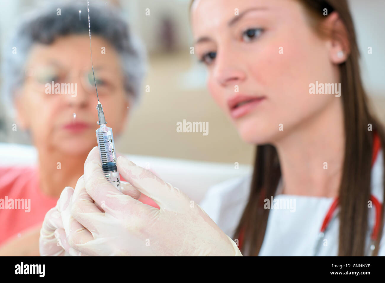Doctor preparing an injection Stock Photo - Alamy