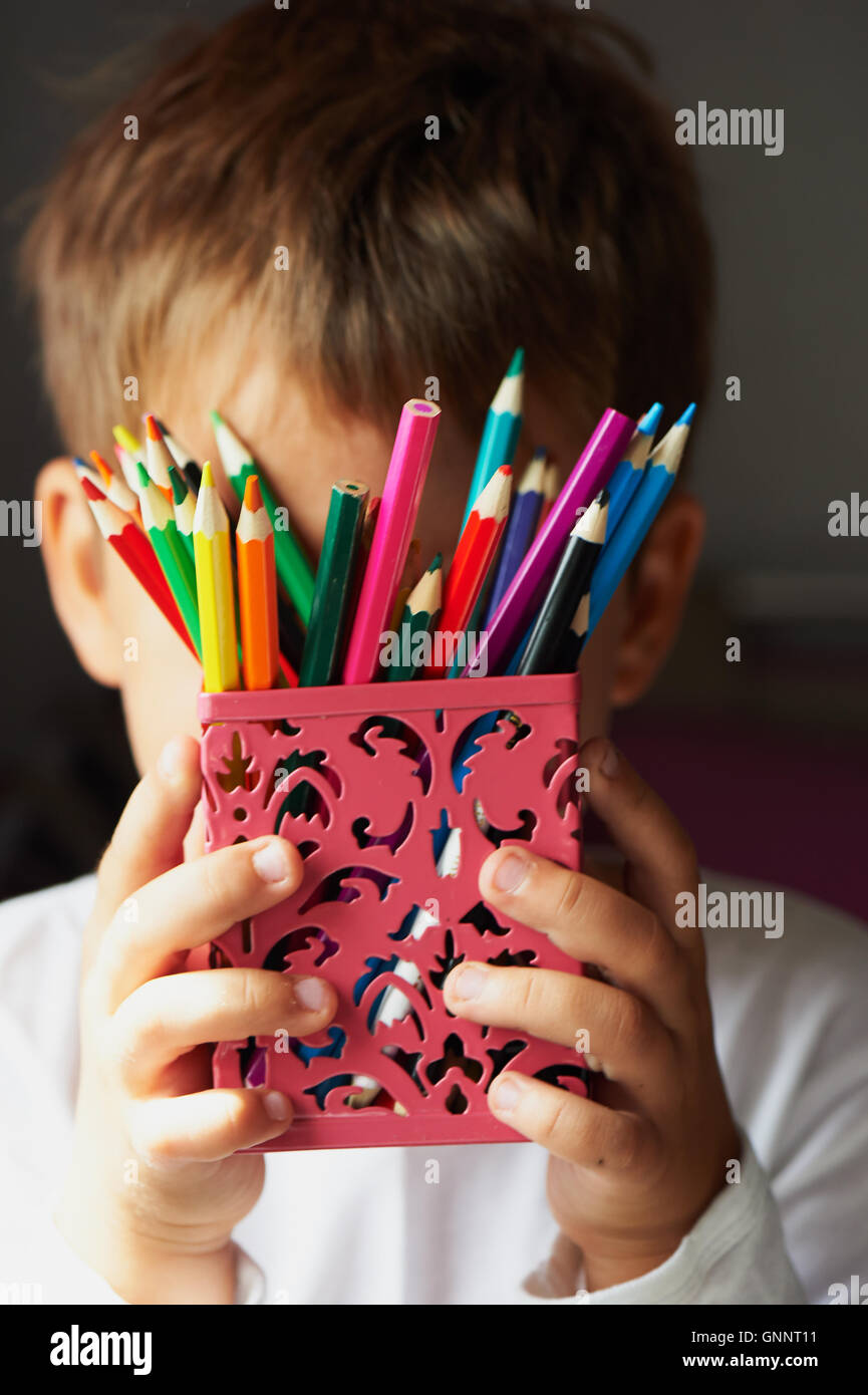 Colored pencils in children's hands, sharpened . Macro Stock Photo - Alamy