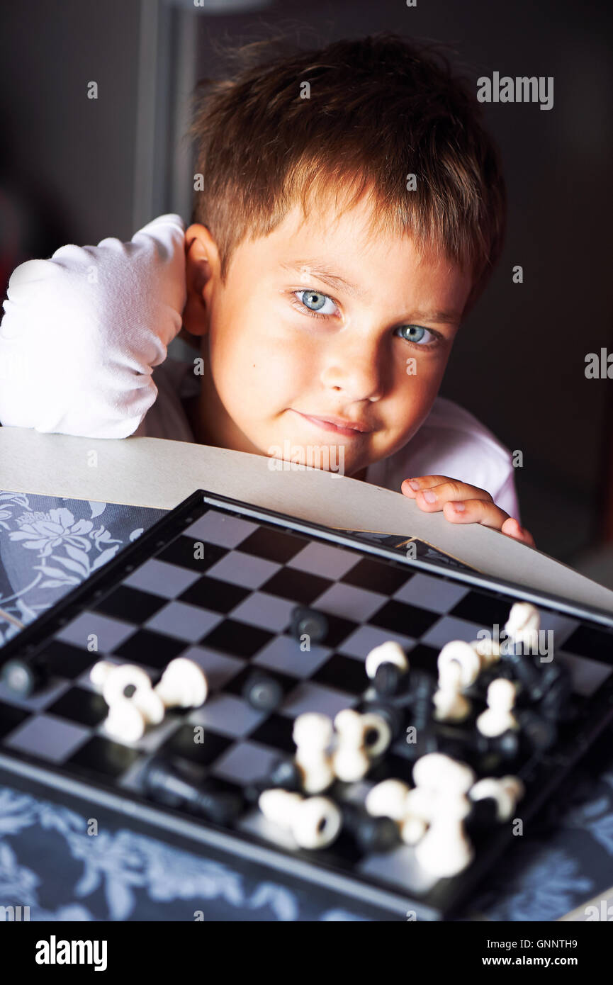 Little boy playing chess. Close-up portrait, bokeh Stock Photo - Alamy