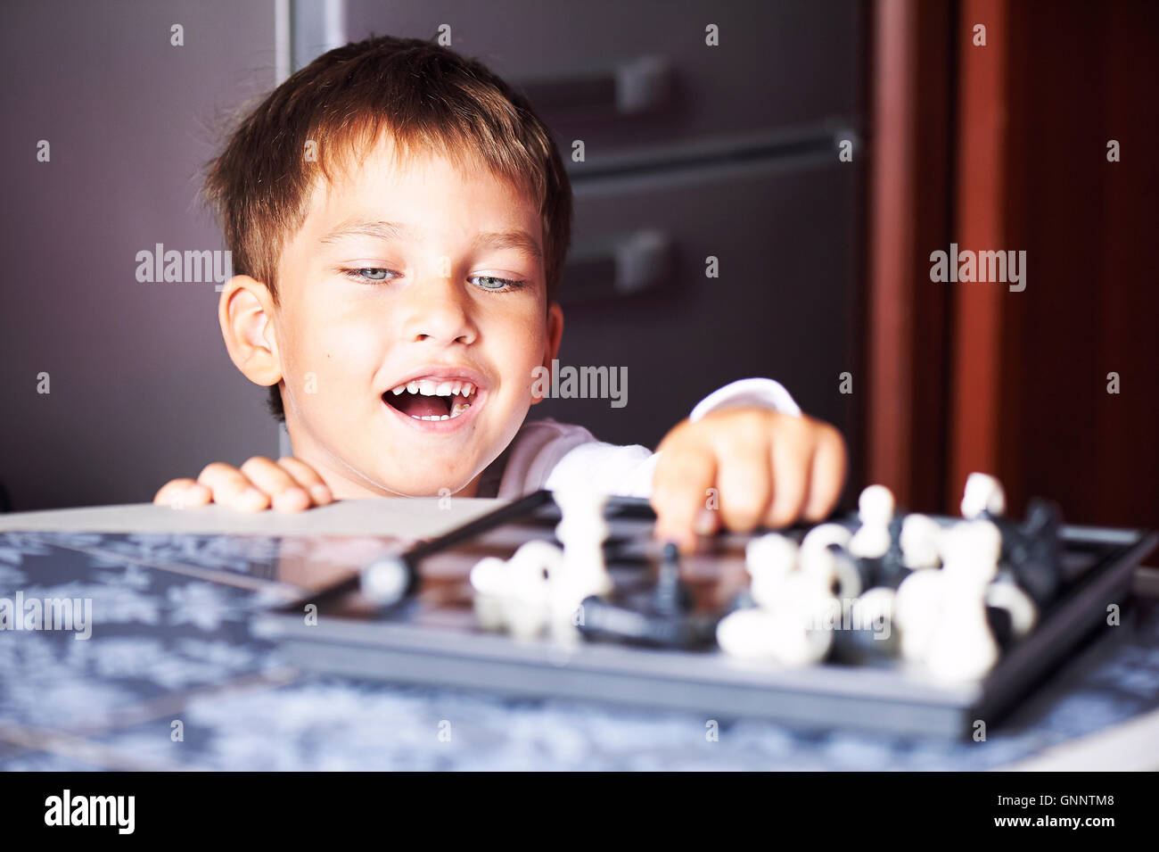 Little boy playing chess. Close-up portrait, bokeh Stock Photo - Alamy