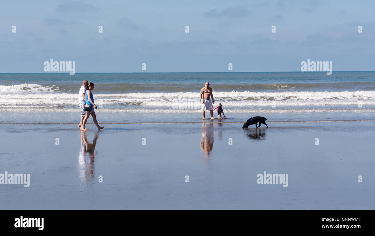 People walking on Ynyslas Beach, near Aberystwyth in Ceredigion, Wales ...