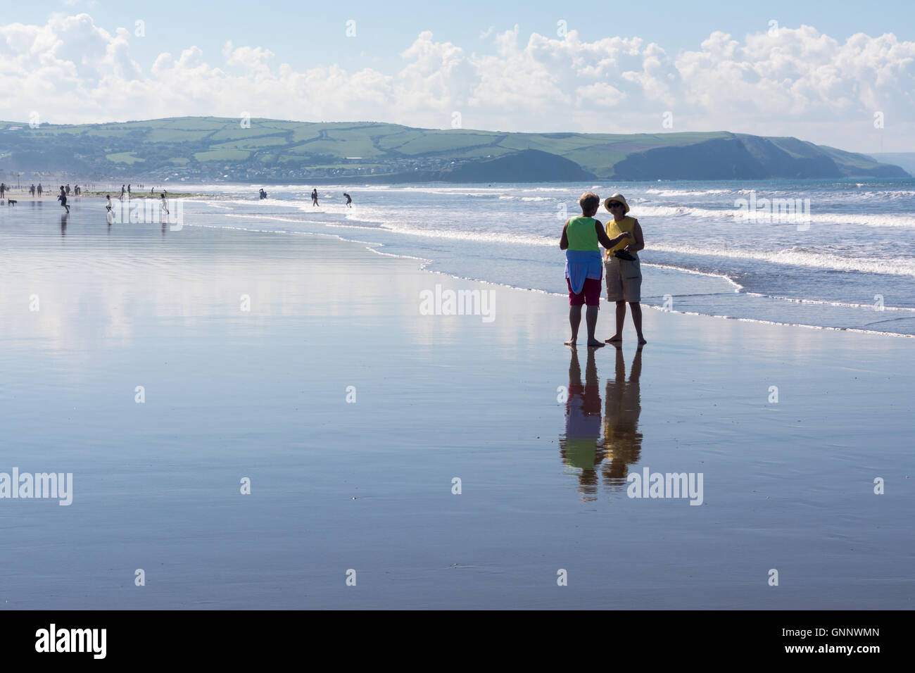 People walking on Ynyslas Beach, near Aberystwyth in Ceredigion, Wales ...