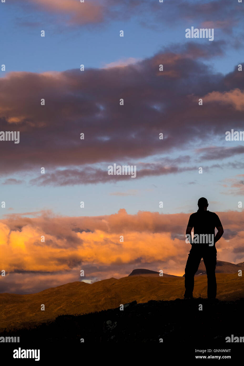 Hiker enjoying the sunset Stock Photo - Alamy