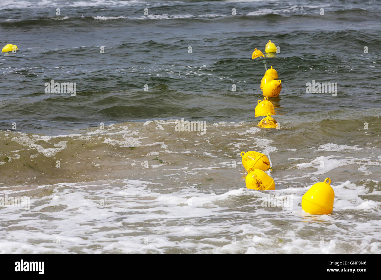 Yellow buoys on the Baltic Sea waters Stock Photo - Alamy