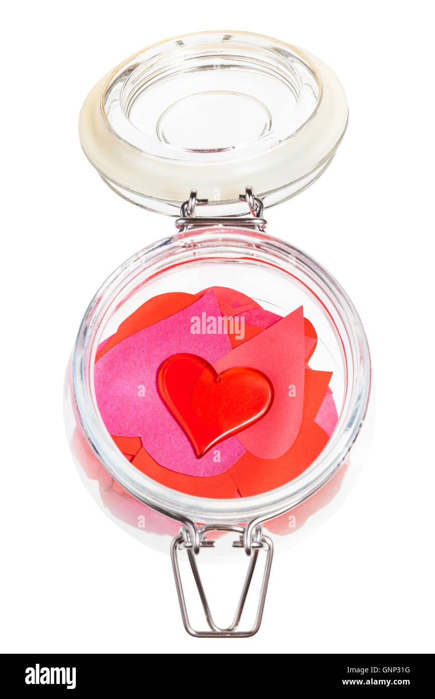 top view of one red heart on pile of hearts cut out from paper in open ...