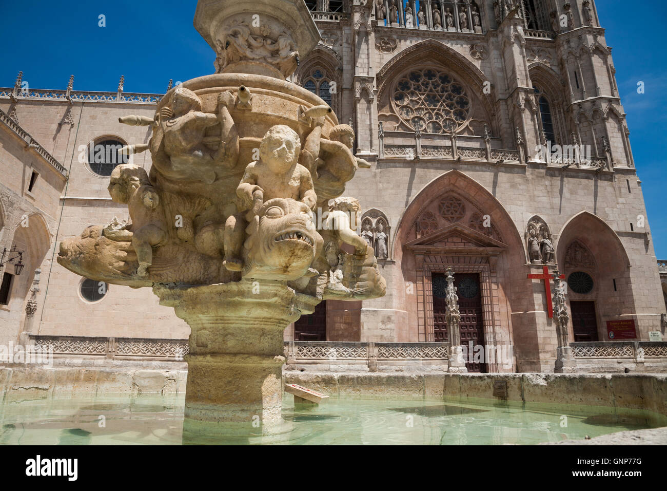 sculpture in fountain next to facade landmark of famous gothic catholic ...