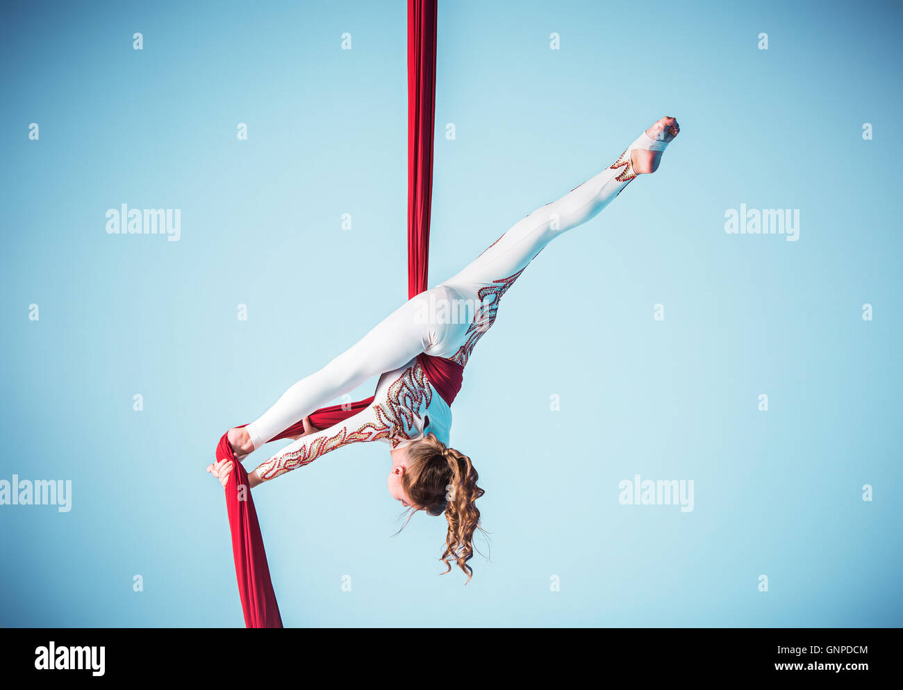 Graceful gymnast performing aerial exercise Stock Photo - Alamy