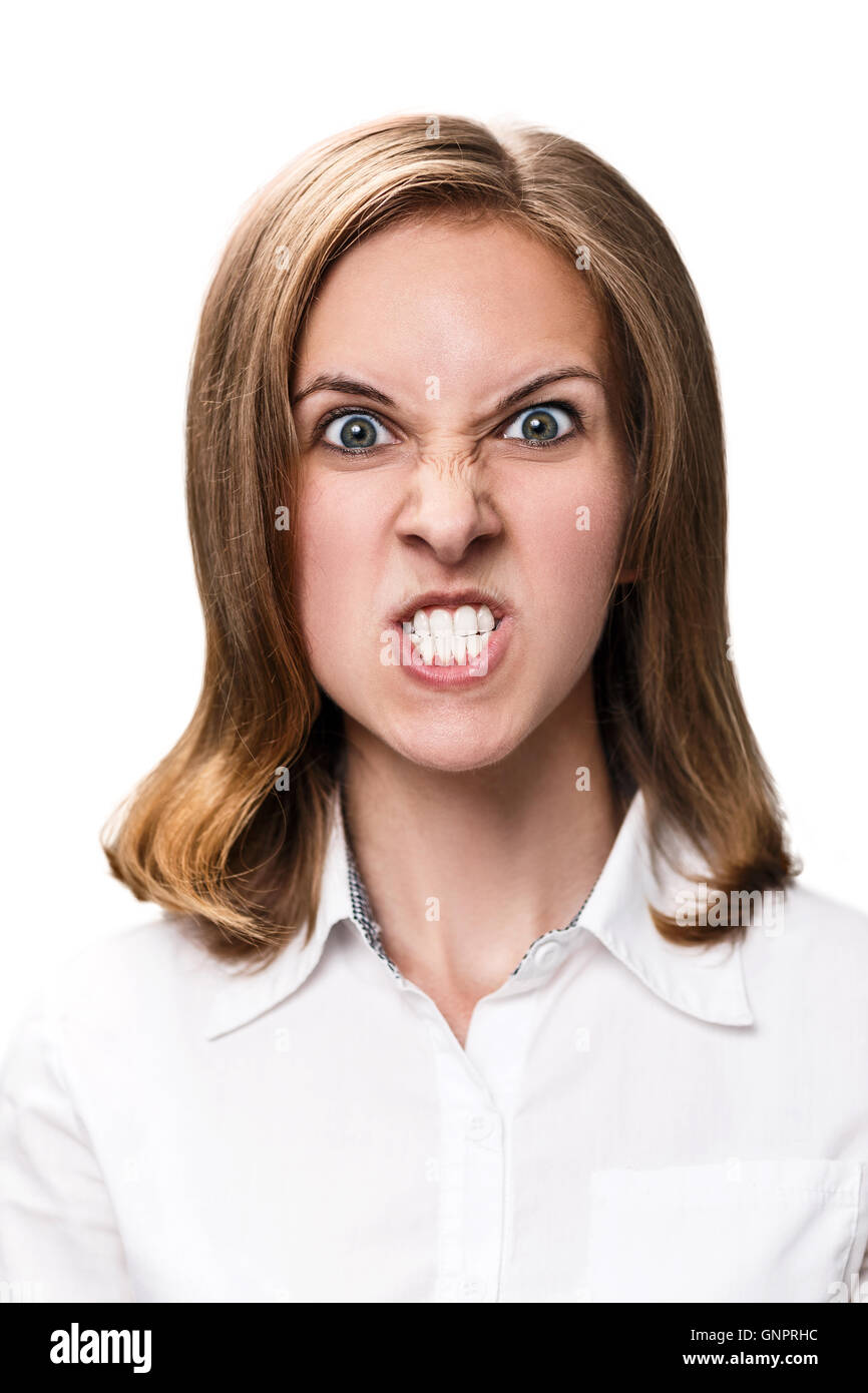 Young and very angry woman isolated on white background Stock Photo - Alamy