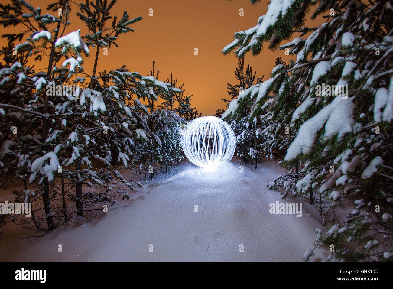 Futuristic glowing sphere on a background of a beautiful winter ...
