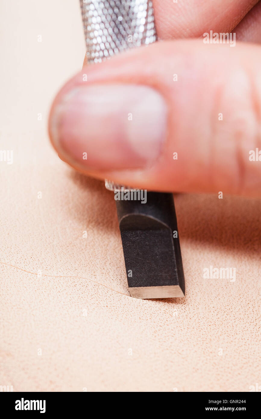 leathercrafting - blade of swivel knife cut leather surface close up ...