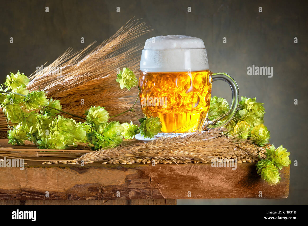 Glass of beer and raw material for beer production Stock Photo - Alamy