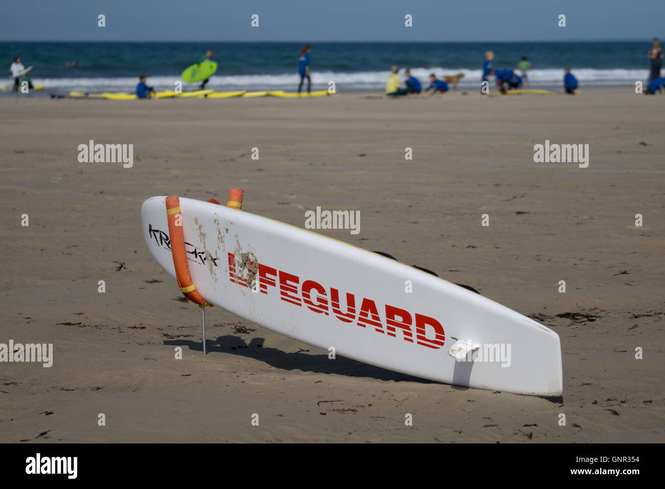 A Lifeguard Surfboard positioned as a marker designating the safe place ...